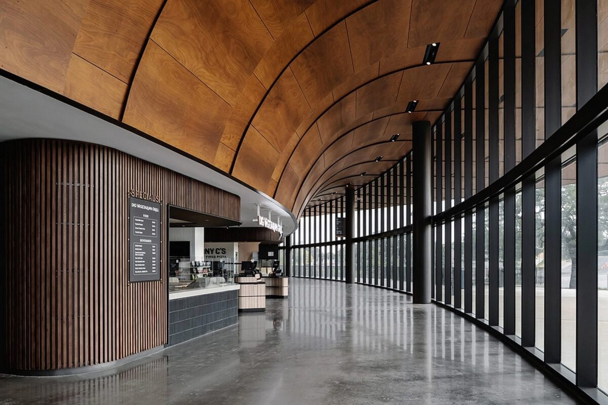 Curved Wooden Soffit at UT Moody Center Arena - unlea